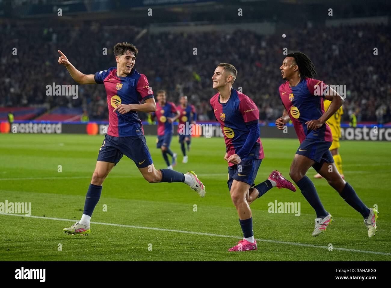 Barcelona's Pau Cubarsi, left, Barcelona's Fermin Lopez, center, and ...