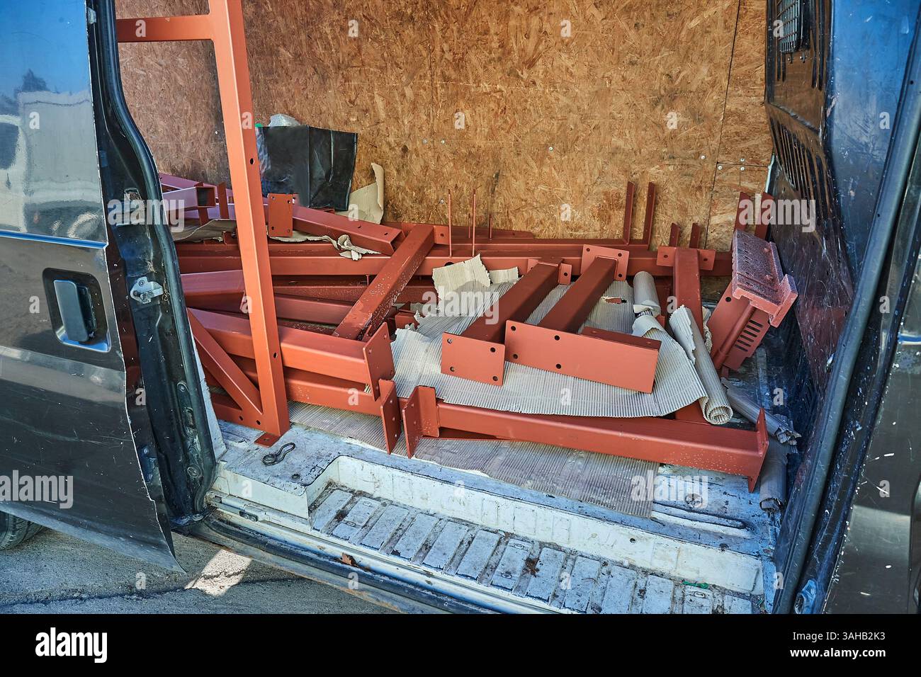 Steel bracket sections for building construction hauled in a van cargo ...