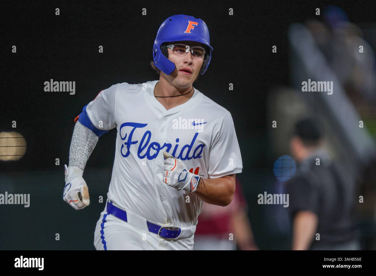 Florida infielder Brendan Lawson (11) runs the bases hitting a 3-run ...