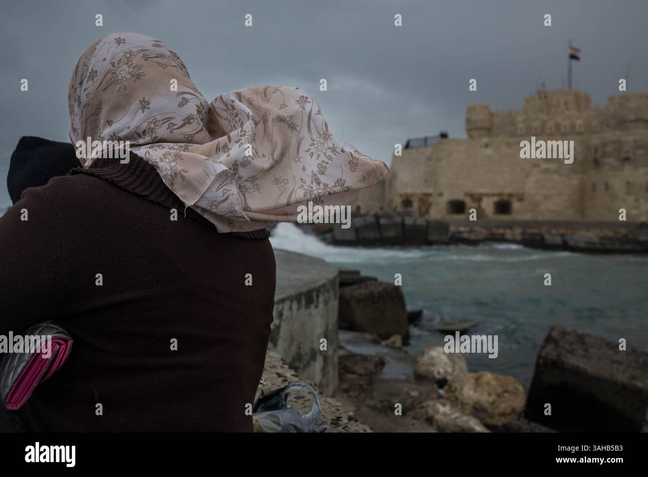 Apr 11, 2015 - Alexandria, Egypt - A woman looks out towards the ...