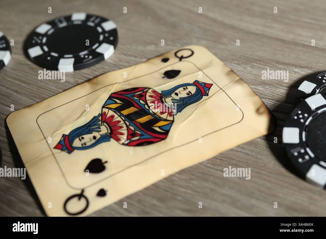 Old vintage playing card and poker chips on wooden table, closeup Stock ...