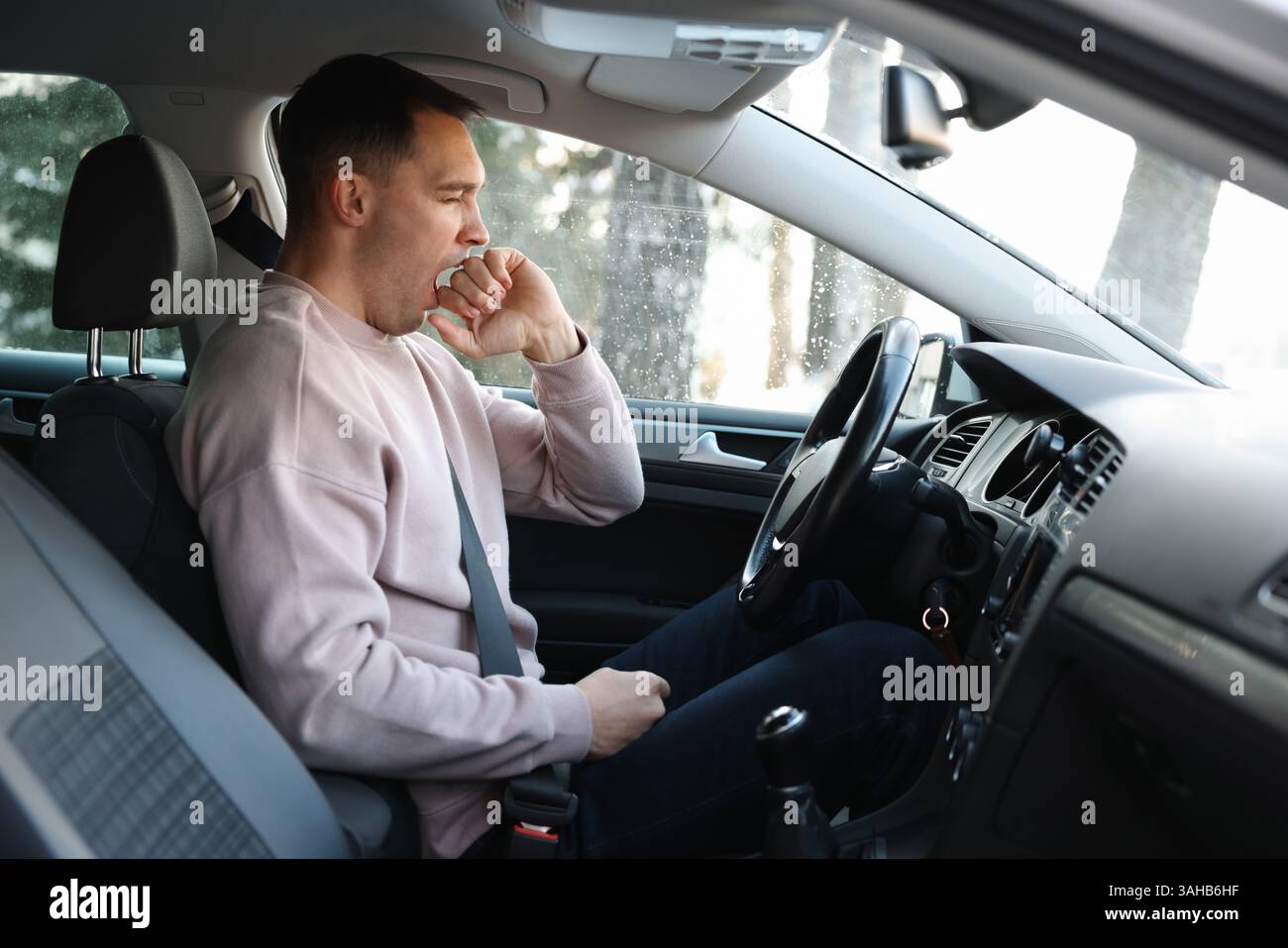 Sleepy driver yawning in his modern car Stock Photo - Alamy