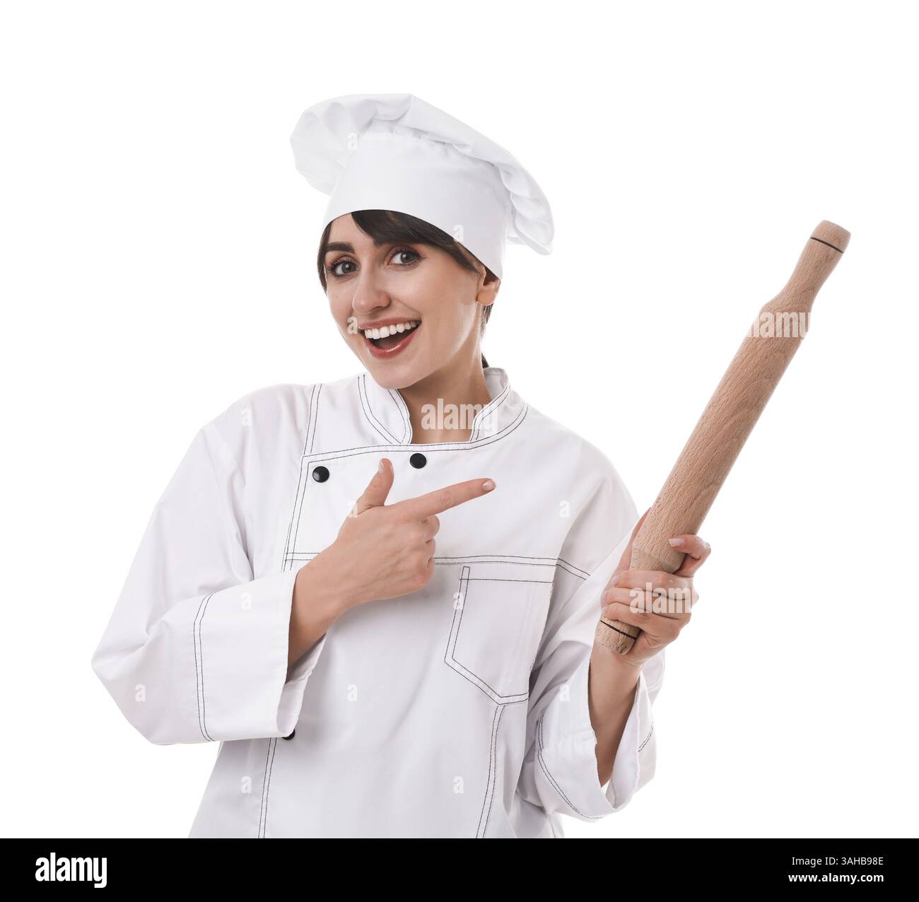 Professional chef pointing at rolling pin on white background Stock ...