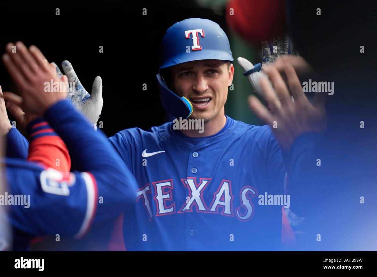 Texas Rangers' Corey Seager (5) celebrates in the dugout after hitting ...
