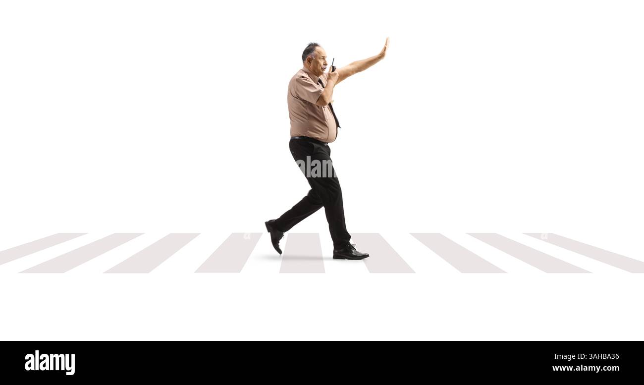Security officer running at a pedestrian crossing with a walkie talkie ...