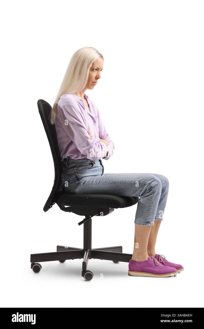 Angry woman sitting in an office chair isolated on white background ...
