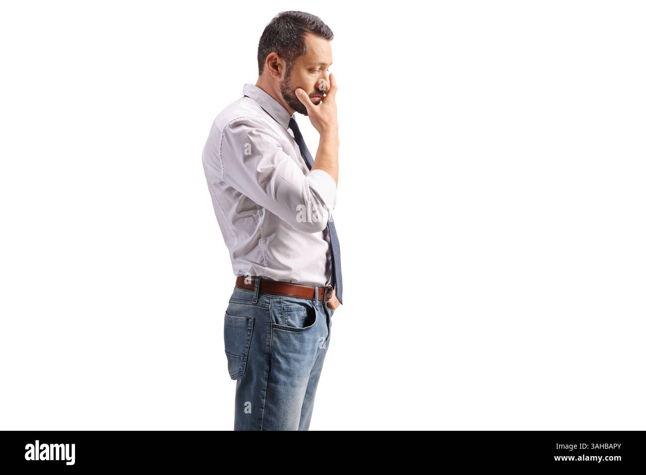 Worried professional man standing and thinking isolated on white ...
