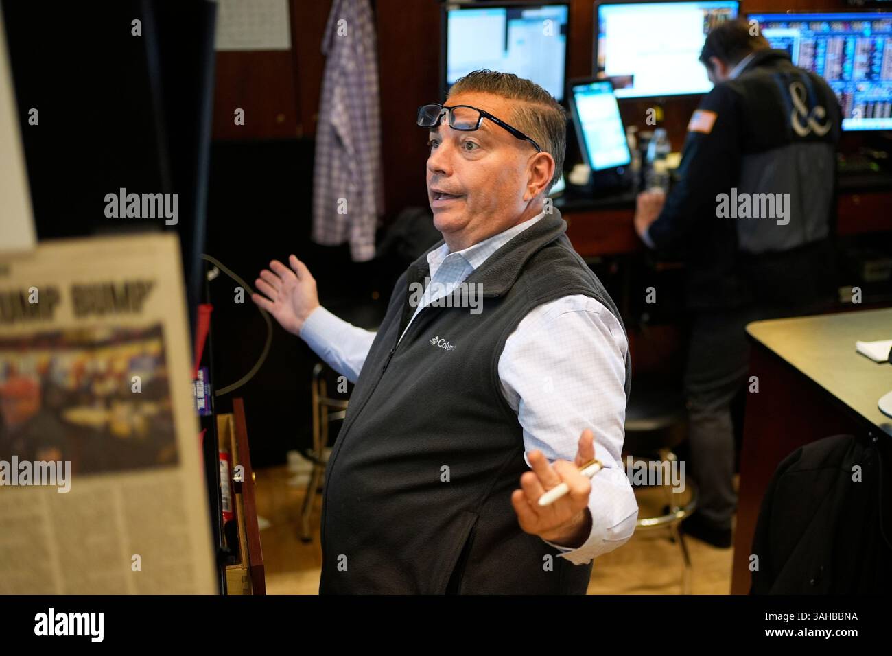 Jonathan Mueller reacts while working on the floor at the New York ...