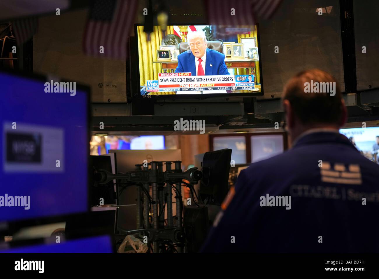 President Donald Trump is displayed on a television on the floor at the ...
