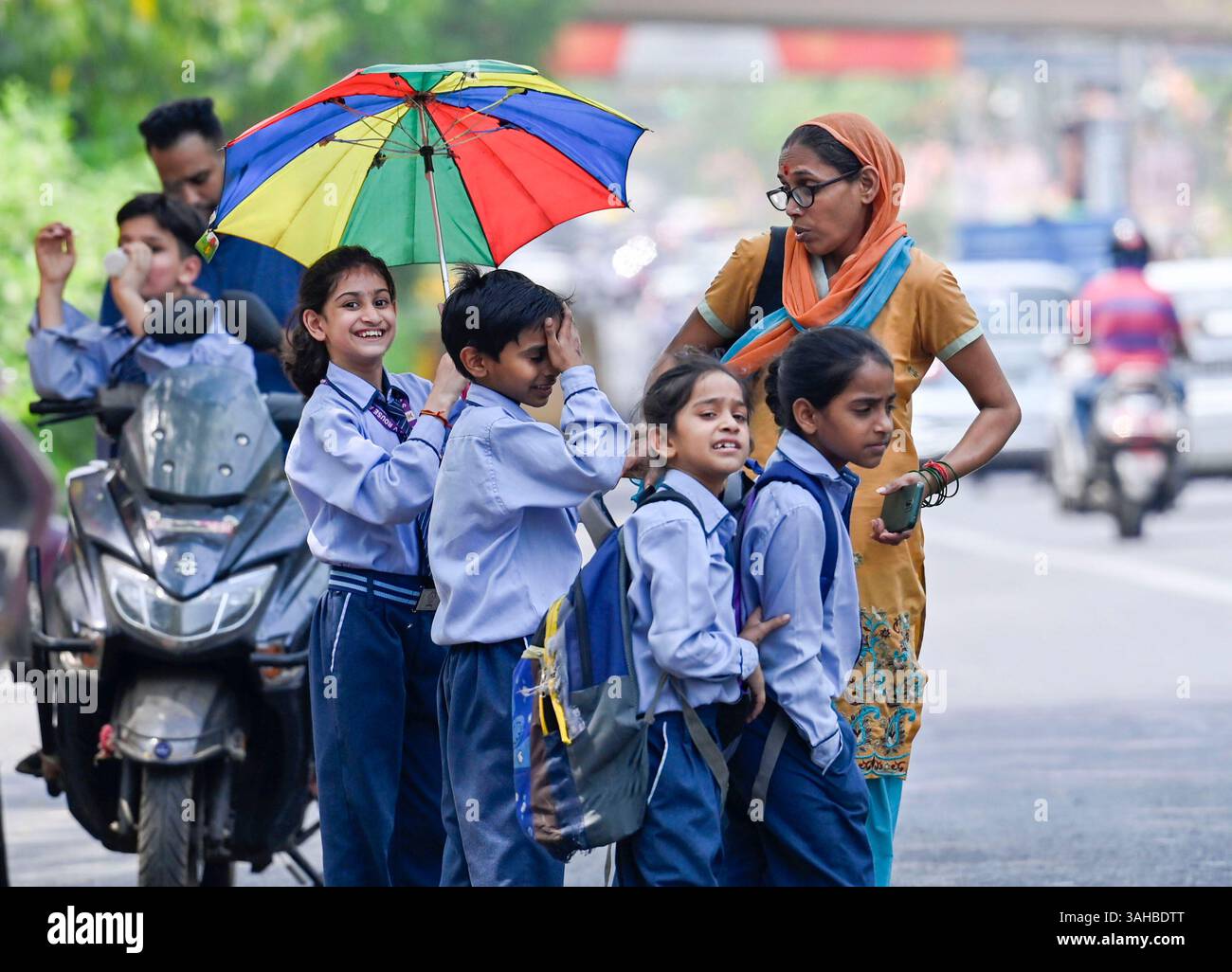 NEW DELHI, INDIA - APRIL 9: School children brave the heatwave during a ...