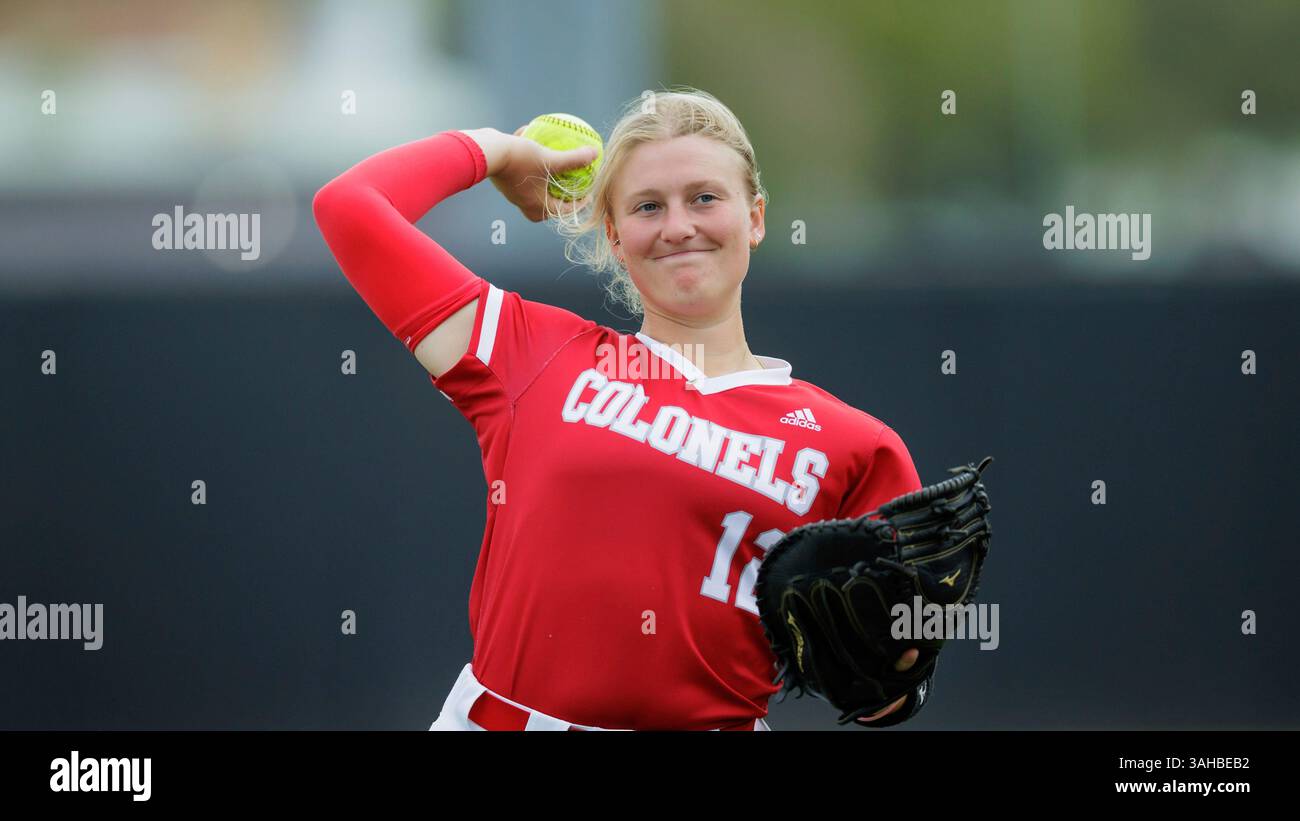 Nicholls catcher Riley Rutherford (12) throws during an NCAA softball ...