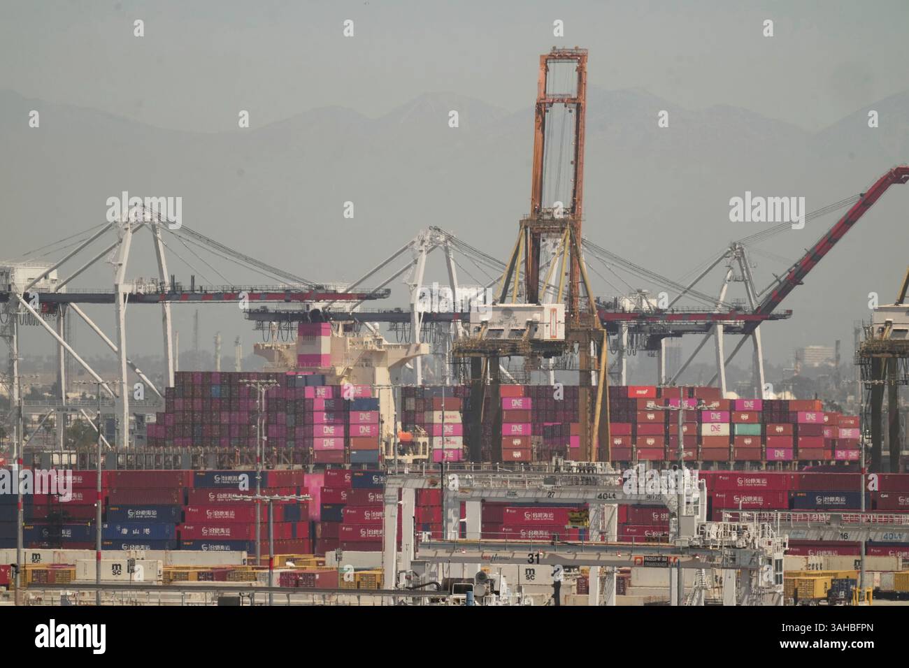 Shipping containers are stacked at the Port of Los Angeles Wednesday ...