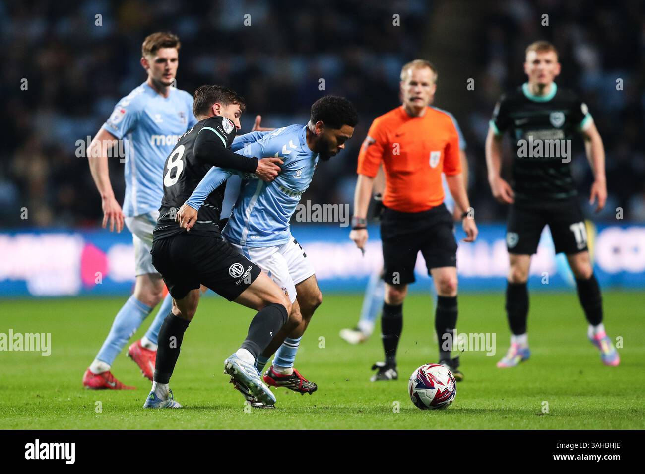 Coventry, UK. 09th Apr, 2025. Jay Dasilva of Coventry City holds off ...