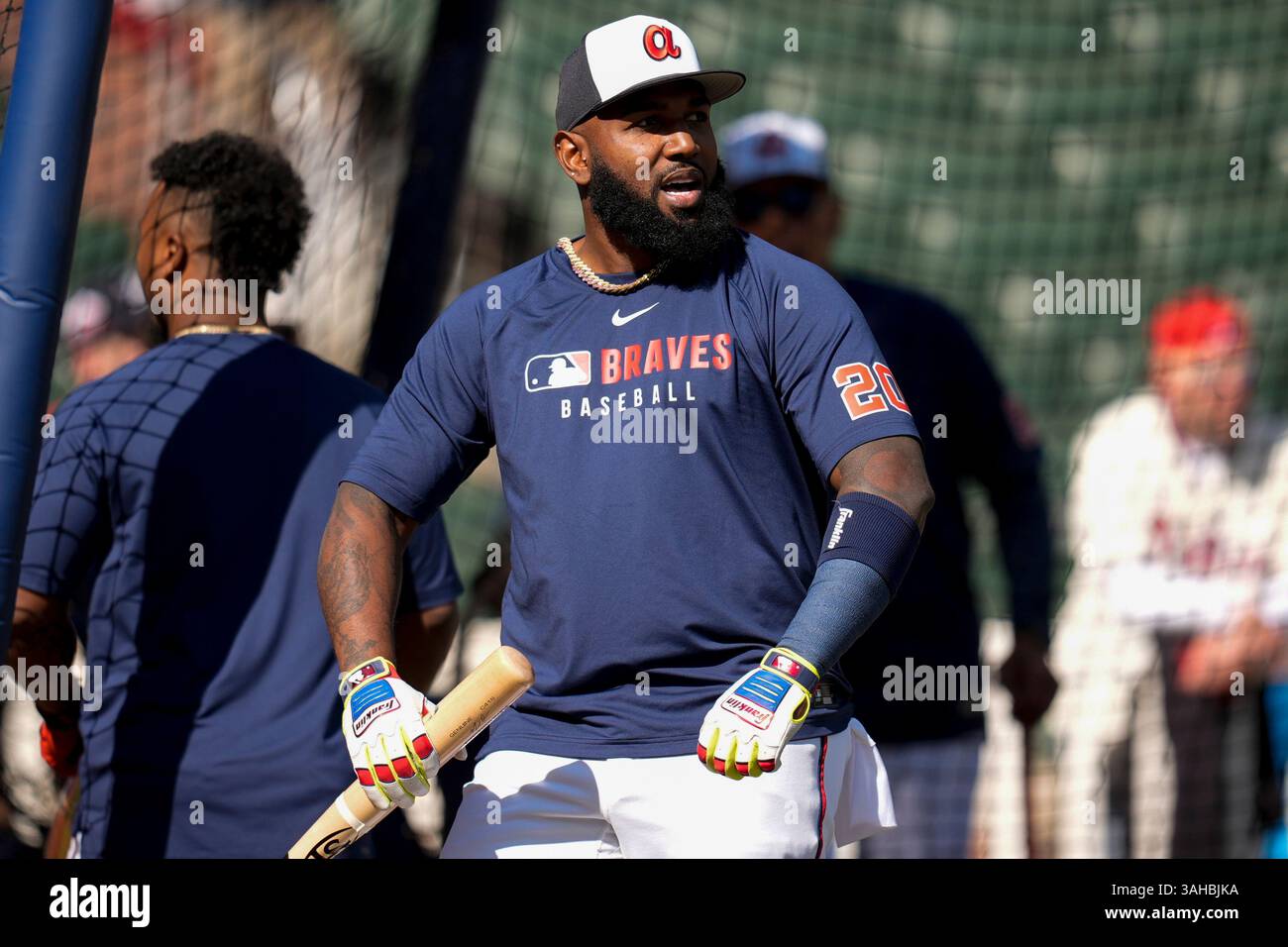 Atlanta Braves designated hitter Marcell Ozuna warms up before a ...