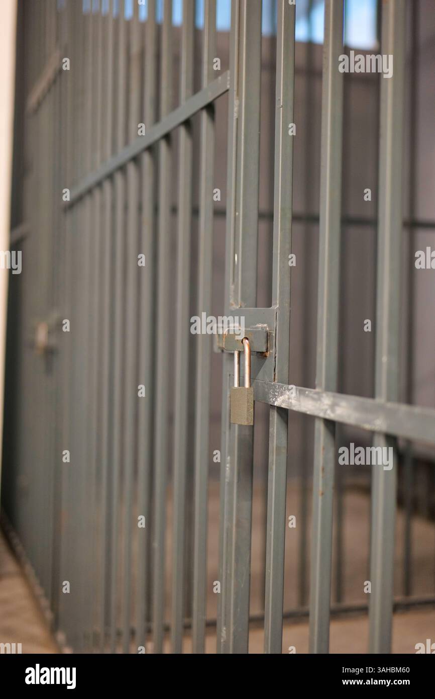 Police station detention room, iron bars Stock Photo - Alamy