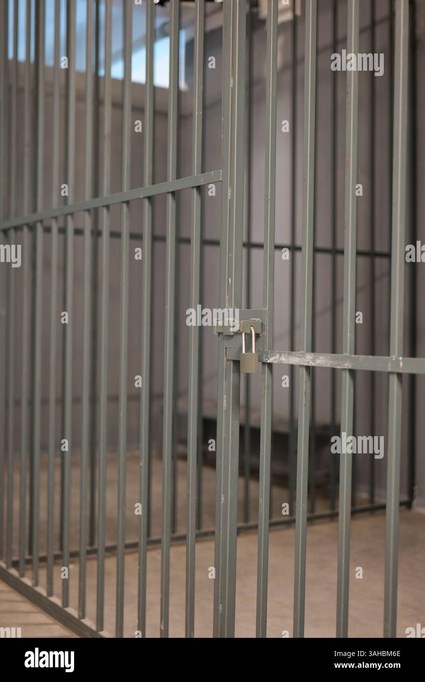 Police station detention room, iron bars Stock Photo - Alamy