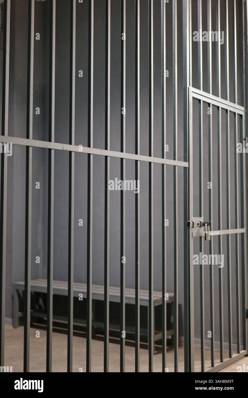 Police station detention room, iron bars Stock Photo - Alamy