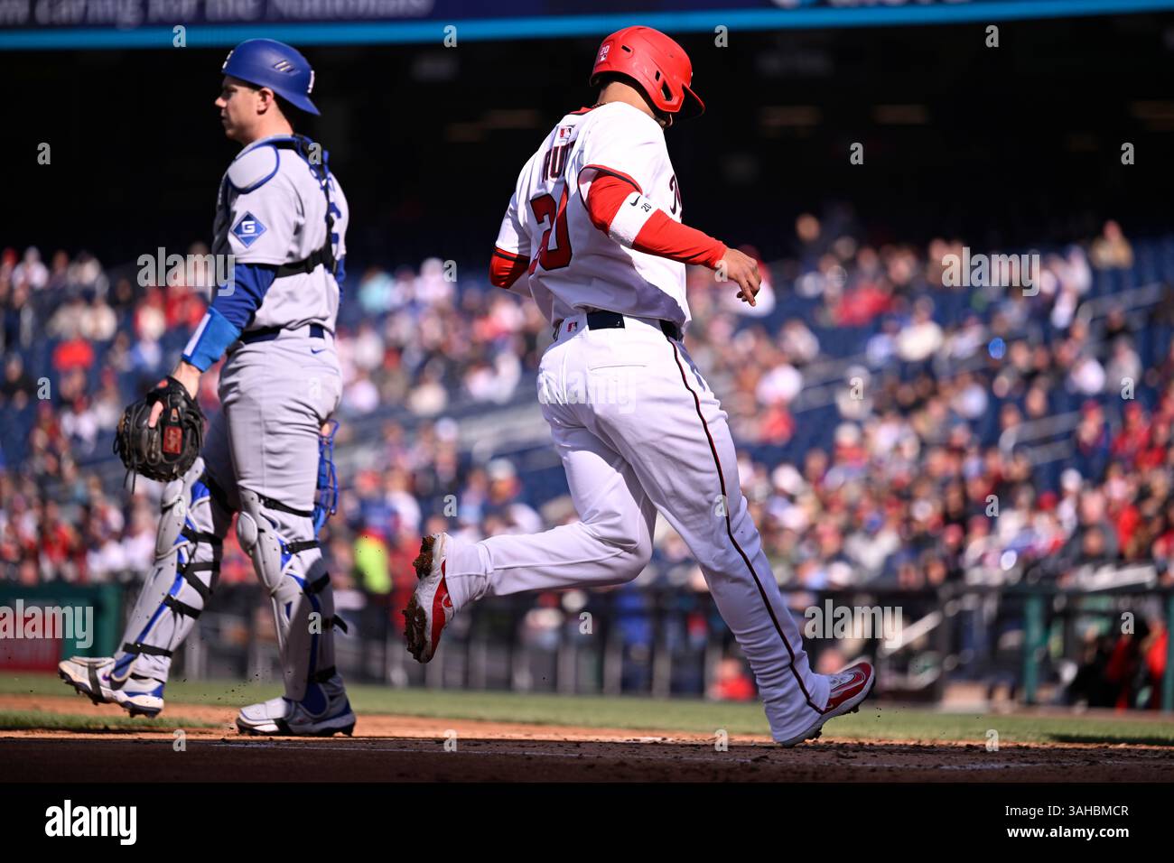 Washington Nationals Keibert Ruiz scores a run past Los Angeles Dodgers ...