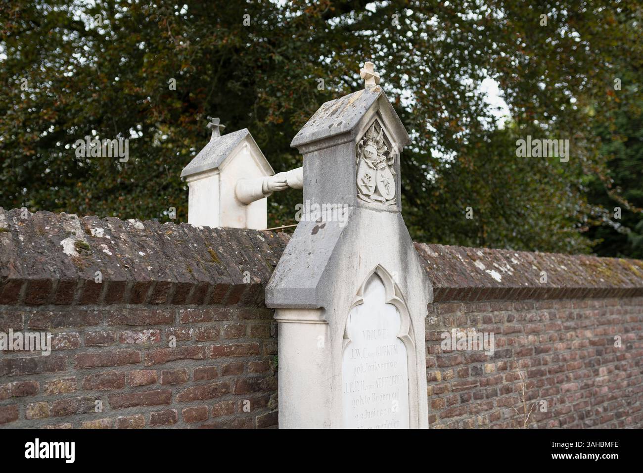Monument of married couple with separate religions each at another side ...