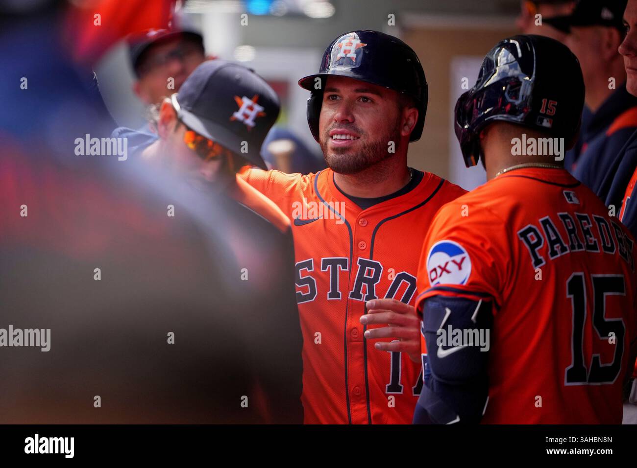 Houston Astros' Victor Caratini is greeted in the dugout after scoring ...