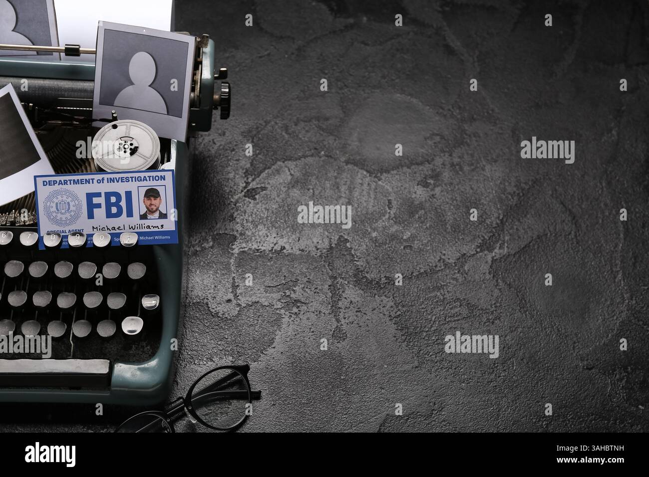 Retro typewriter, document of FBI agent and eyeglasses on dark ...