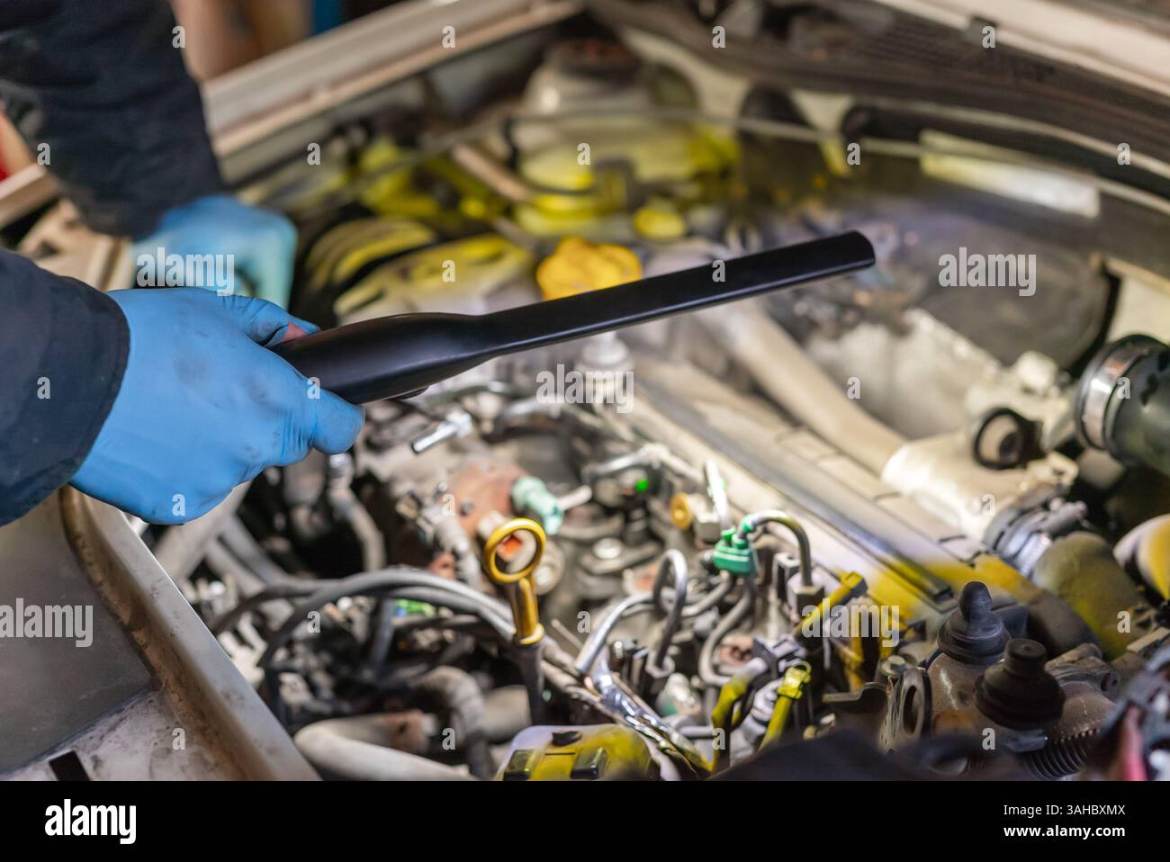 Professional mechanic fixing motor on hi-res stock photography and ...