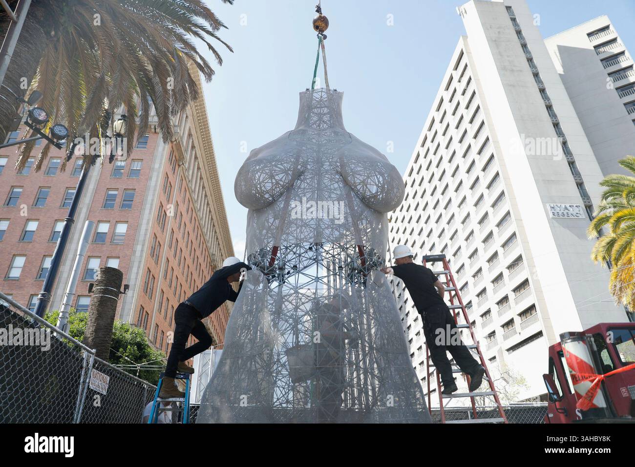 Marco Cochrane, right, and Natale Ramatici, left, installer, work ...