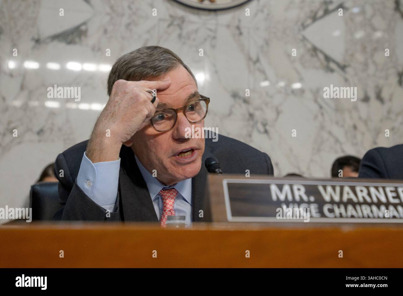 Sen. Mark Warner, D-Va., questions Joseph Kent during a Senate ...