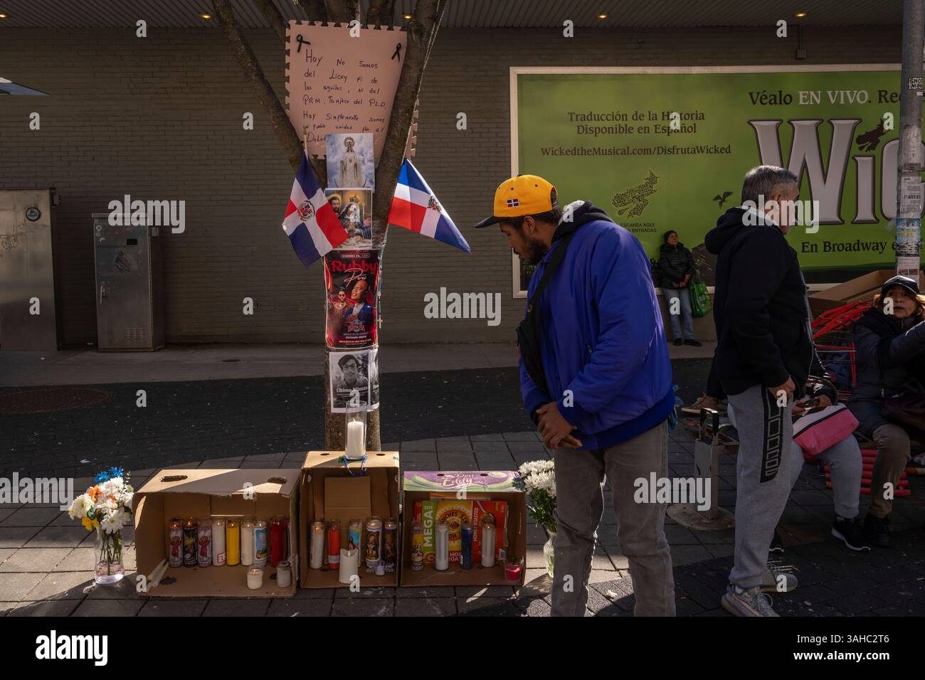 A person looks at a makeshift vigil for the victims of the Jet Set club ...