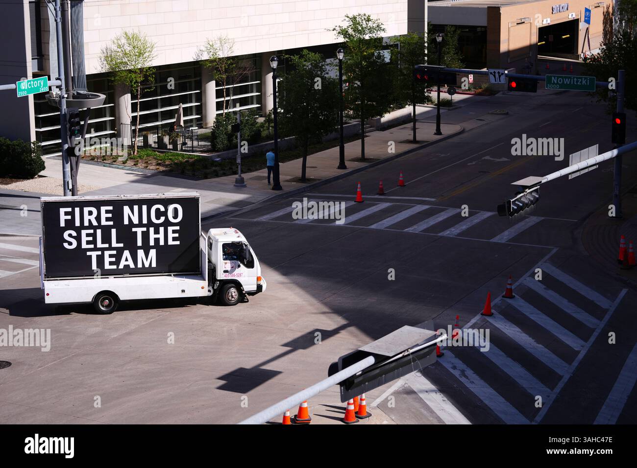 A truck with signage making reference to Dallas Mavericks general ...