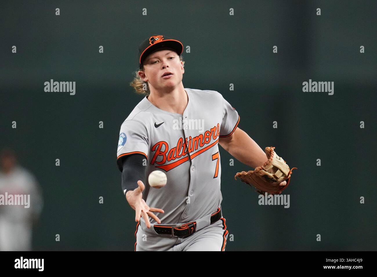 Baltimore Orioles second baseman Jackson Holliday flips the ball to ...