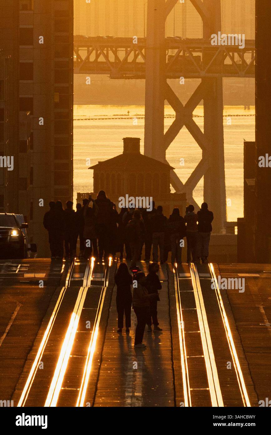 People gathered early Wednesday morning to watch "California Henge," where the sun rises in a ...