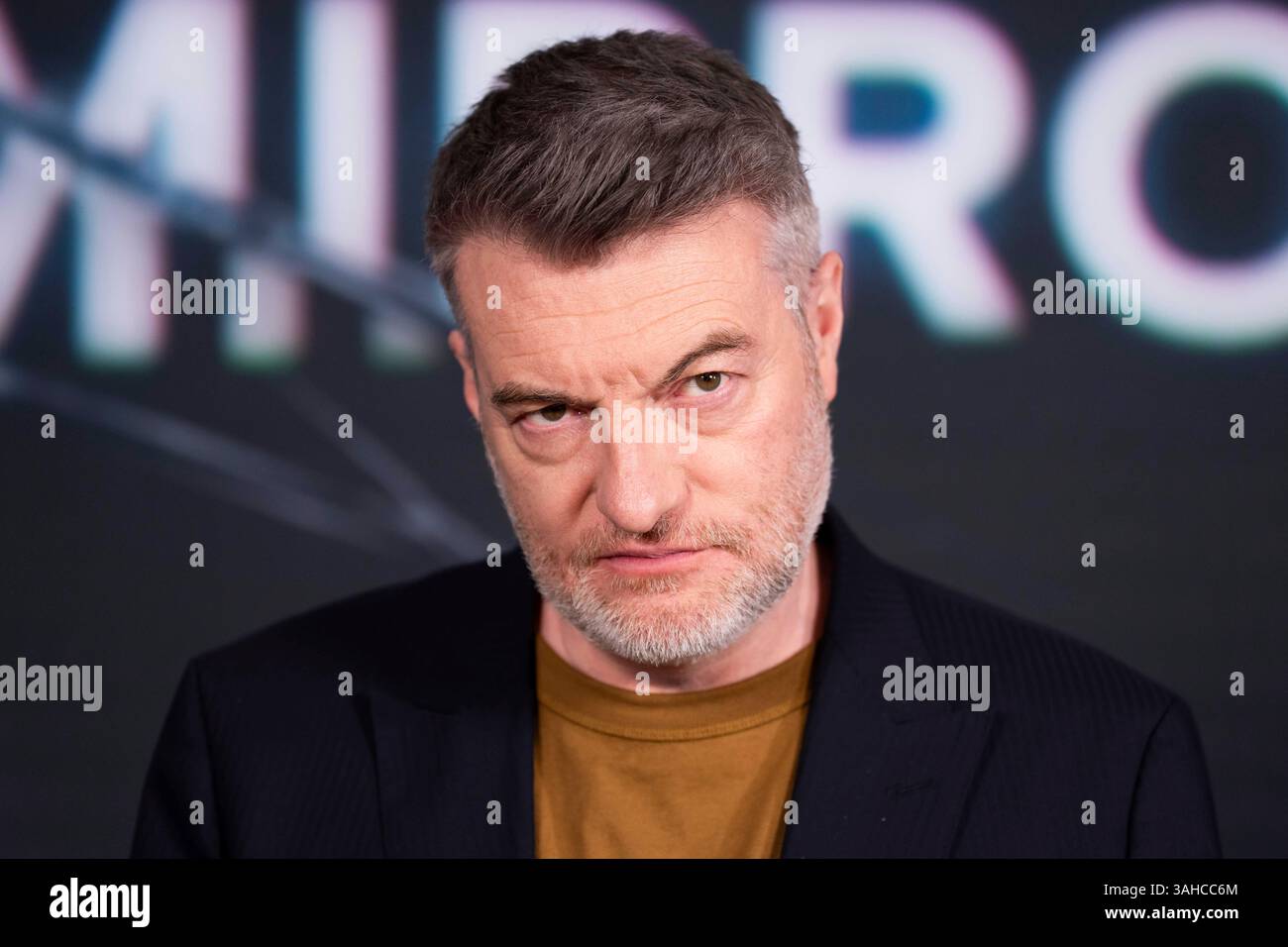 Charlie Brooker poses for photographers upon arrival for the special ...