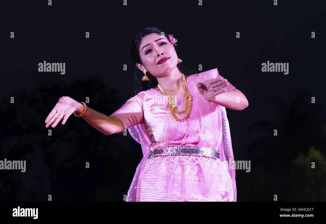 A woman performs Manipuri folk dance in an event of Bihu dance workshop ...