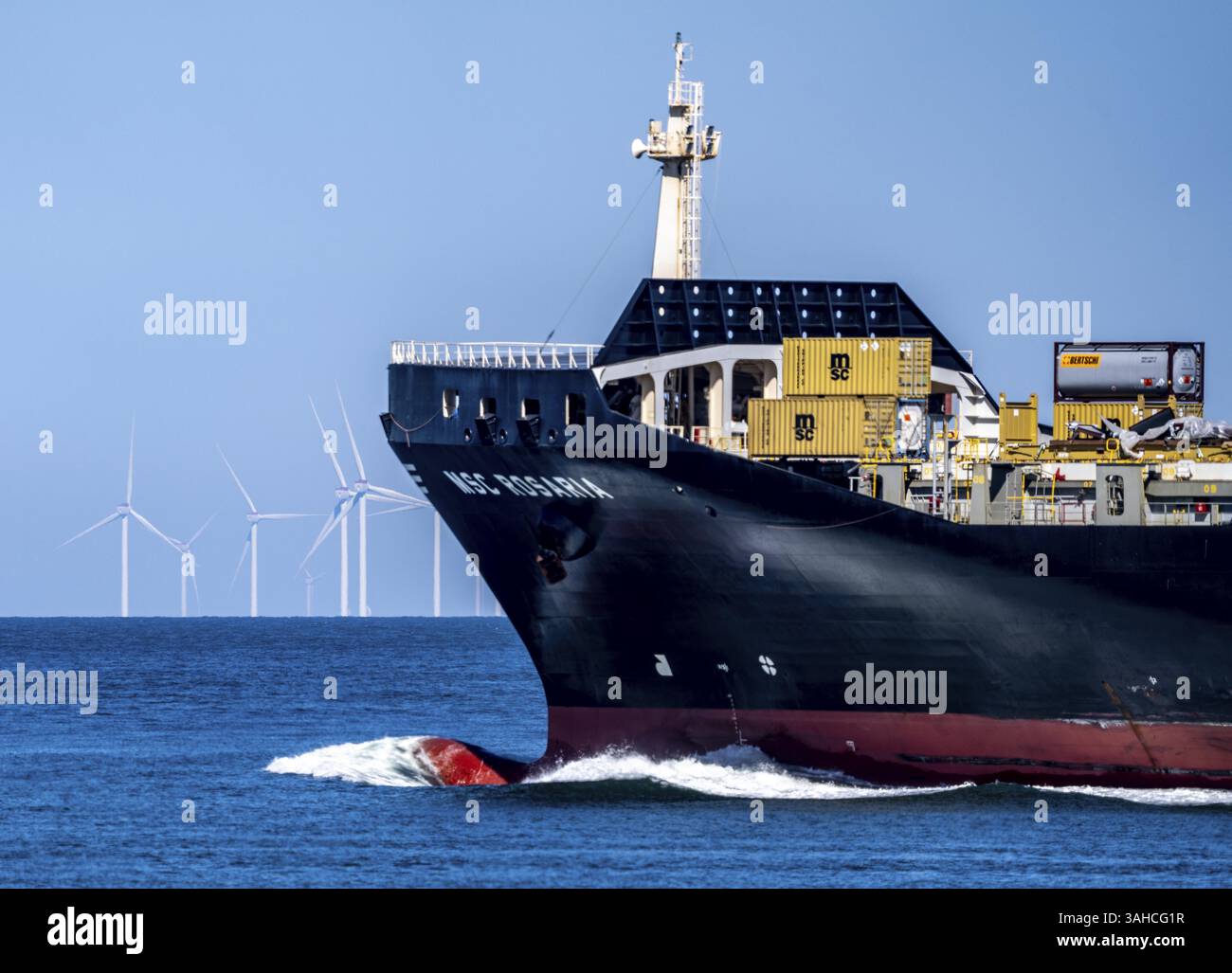 Offshore wind farm Hollandse Kust Zuid, North Sea, container freighter ...
