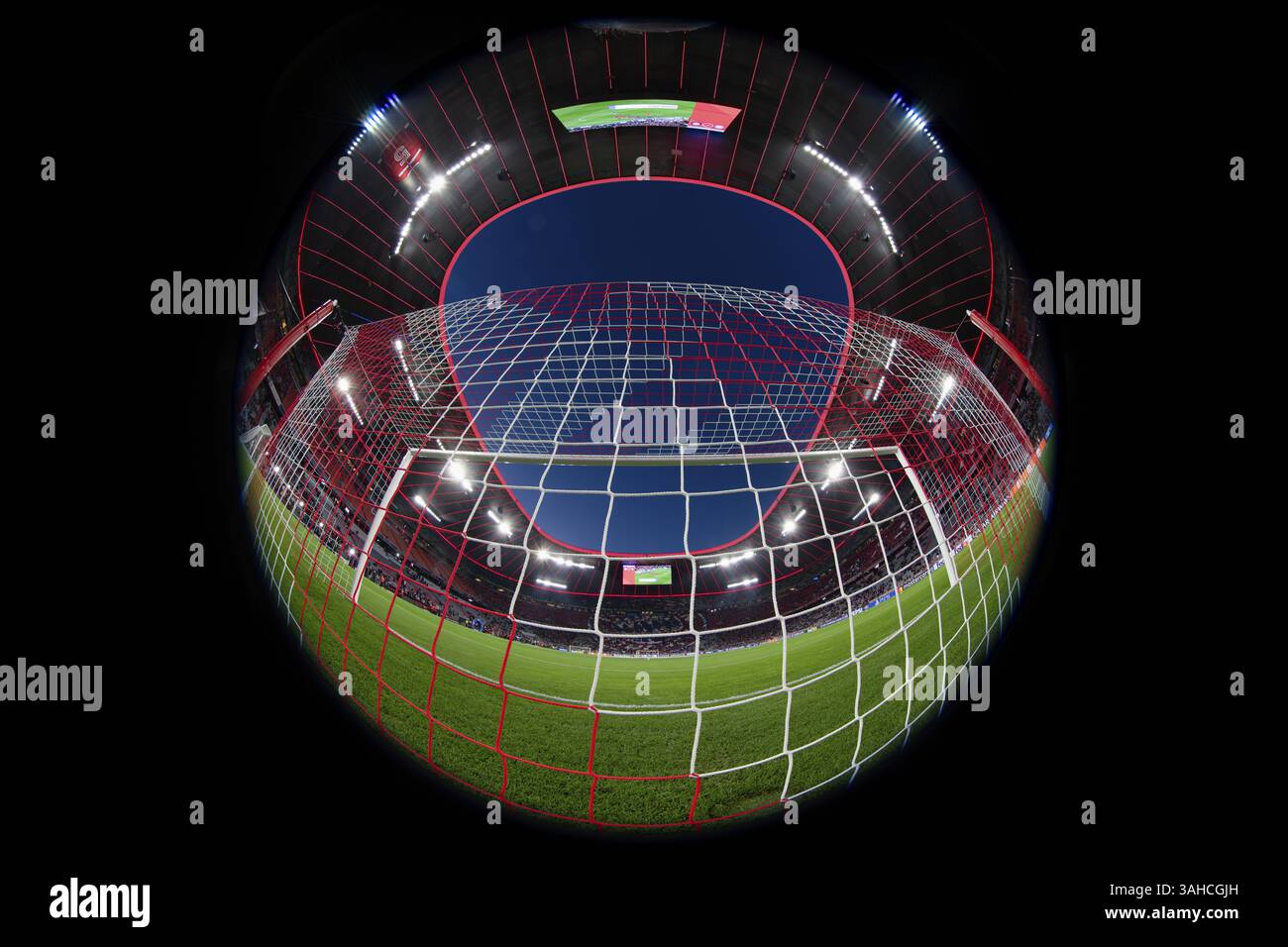 Overview, interior, floodlit match, behind-the-goal perspective, goal ...