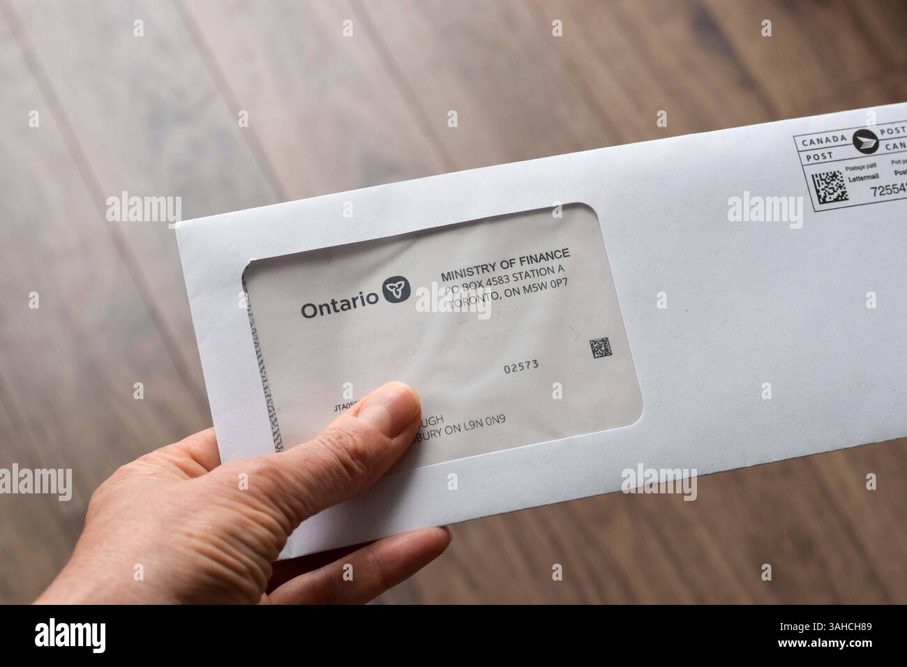January 27, 2025 - Newmarket, Ontario, Canada: Person's hand holding ...