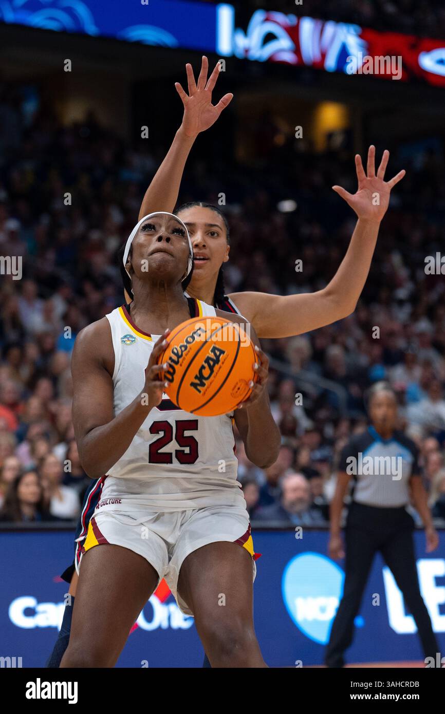 South Carolina guard Raven Johnson (25) shoots over UConn guard Azzi ...