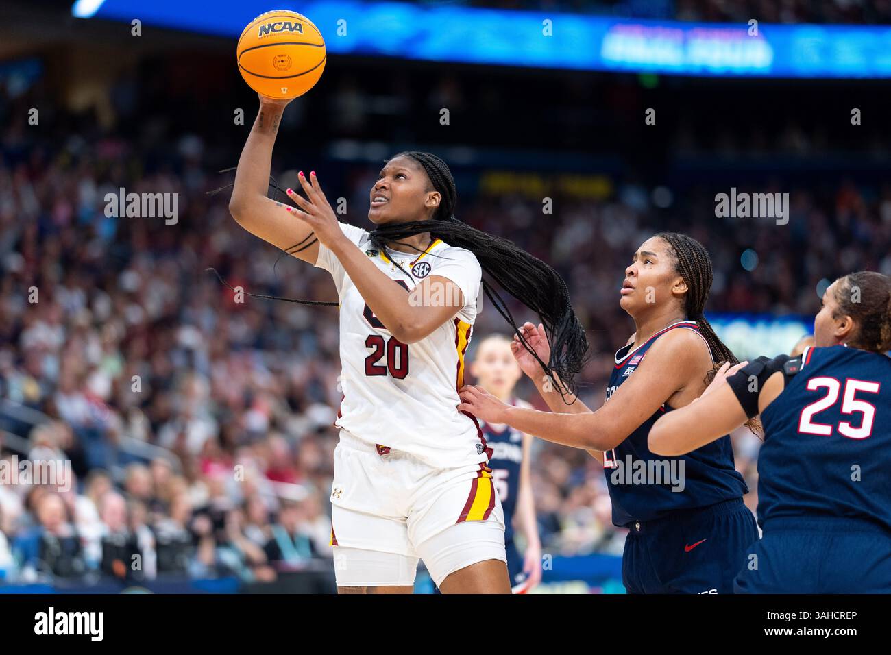 South Carolina forward Sania Feagin (20) shoots over UConn forward Sarah Strong (21) during the ...