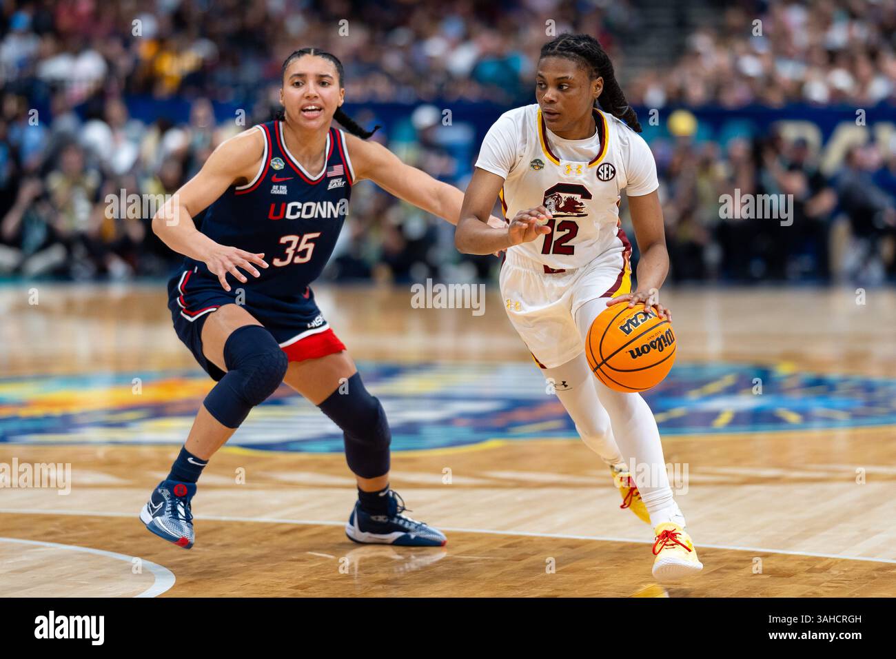 South Carolina guard MiLaysia Fulwiley (12) droves past UConn guard ...