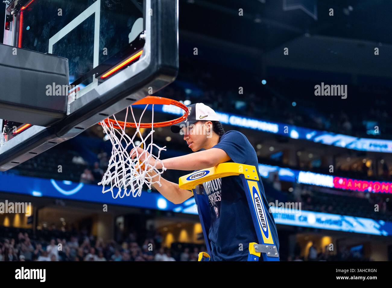 UConn guard Azzi Fudd (35) cuts the net after the National Championship ...