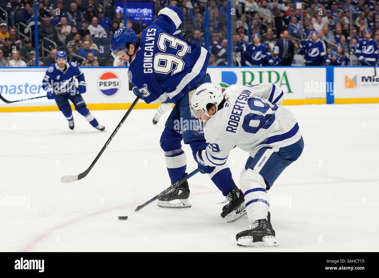 Toronto Maple Leafs left wing Nicholas Robertson (89) strips the puck ...