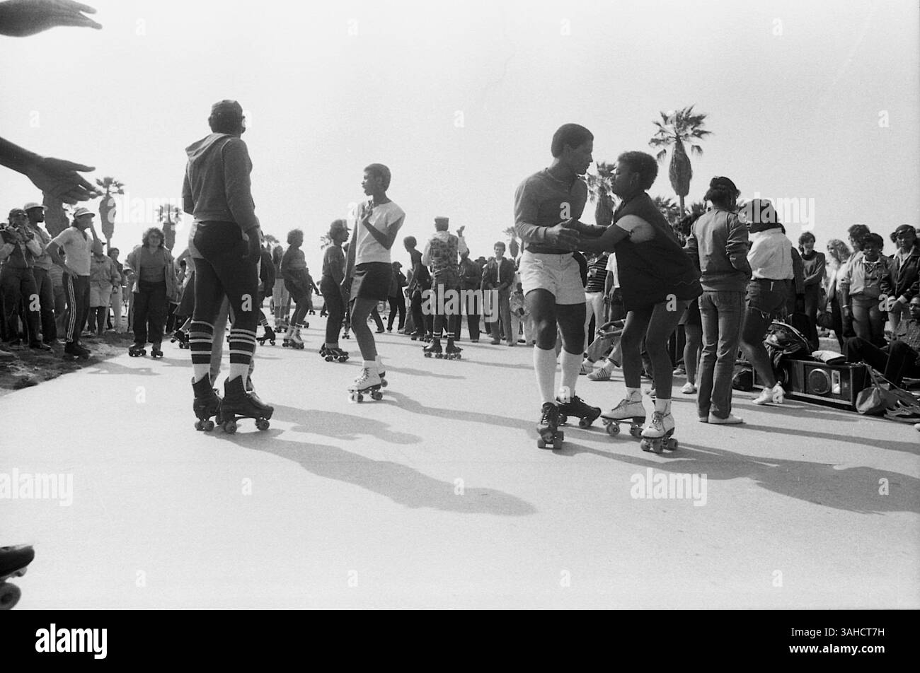 Los Angeles, CA, USA, approx. 1985. People roller skating at Venice ...