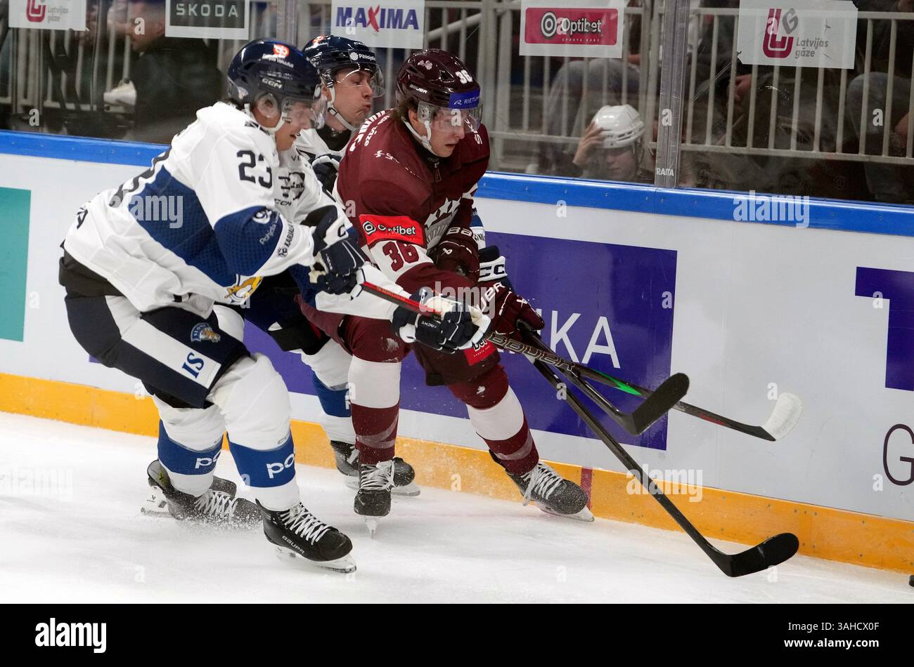 Riga, Latvia. 9th Apr, 2025. Latvia's Martins Lavins (R) battles for ...