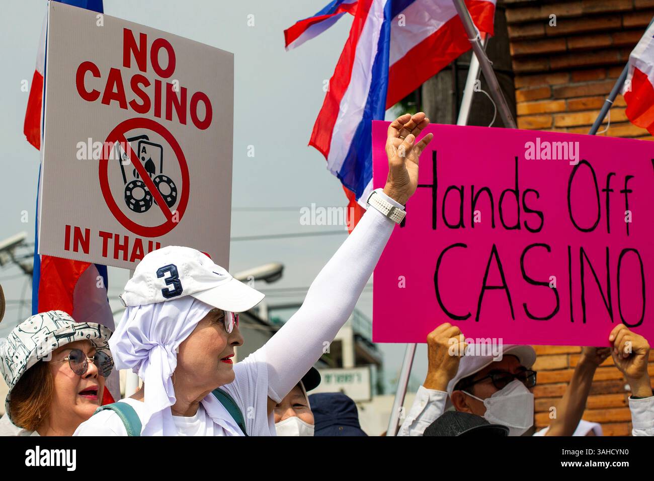 Protesters seen holding placards during a demonstration to protest the ...