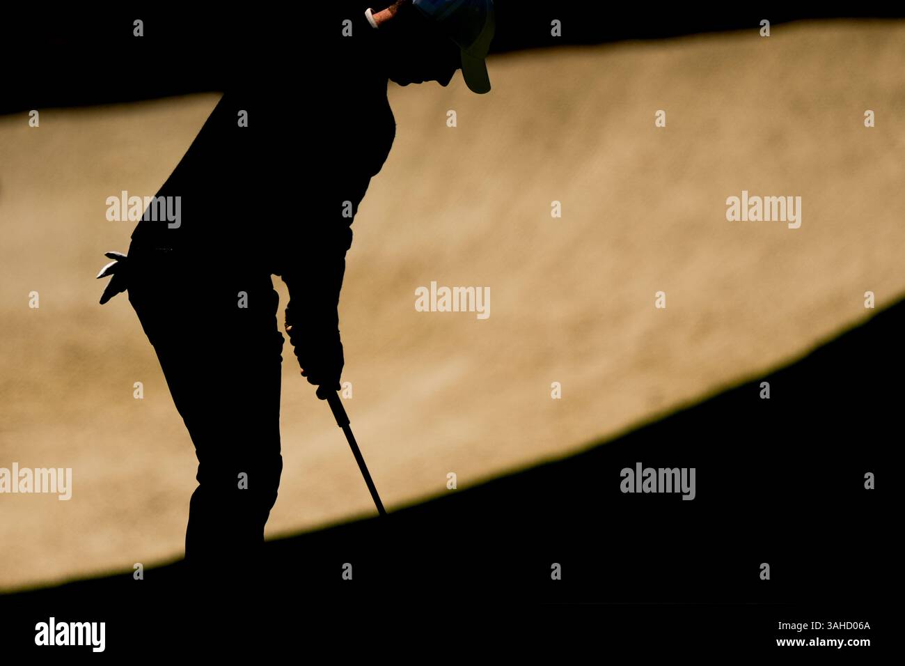 Rory McIlroy, of Northern Ireland, putts on the 13th green during a ...