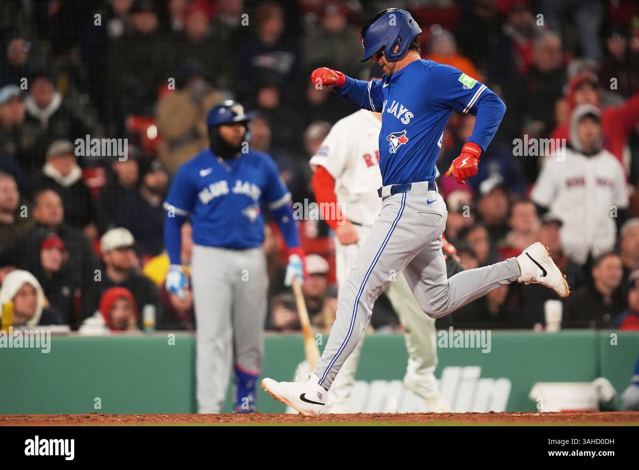 Toronto Blue Jays' Ernie Clement scores on a sacrifice fly by Bo ...