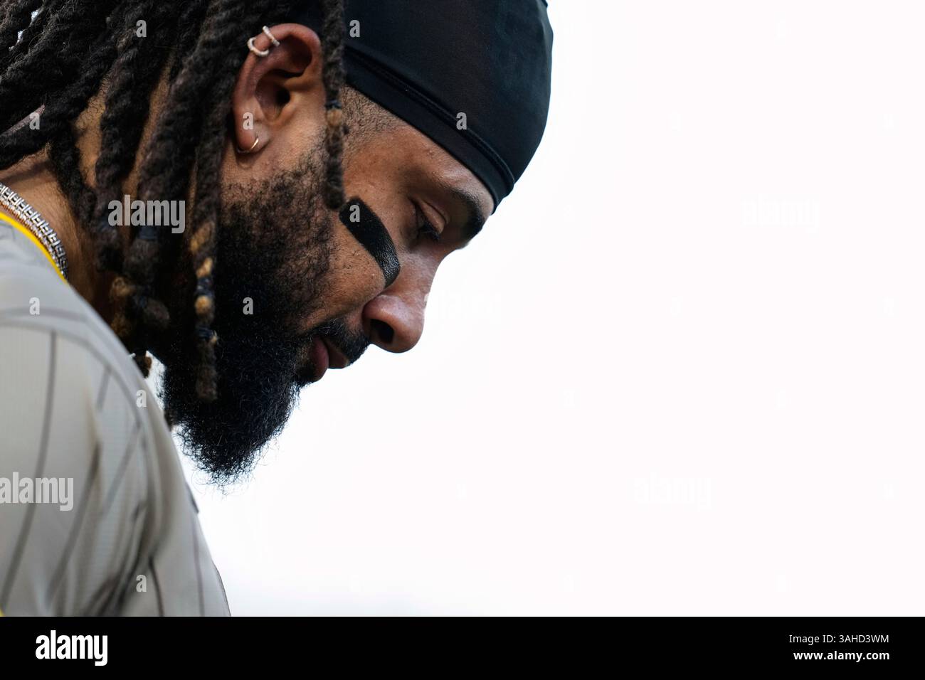 San Diego Padres' Fernando Tatis Jr. listens to the national anthem ...