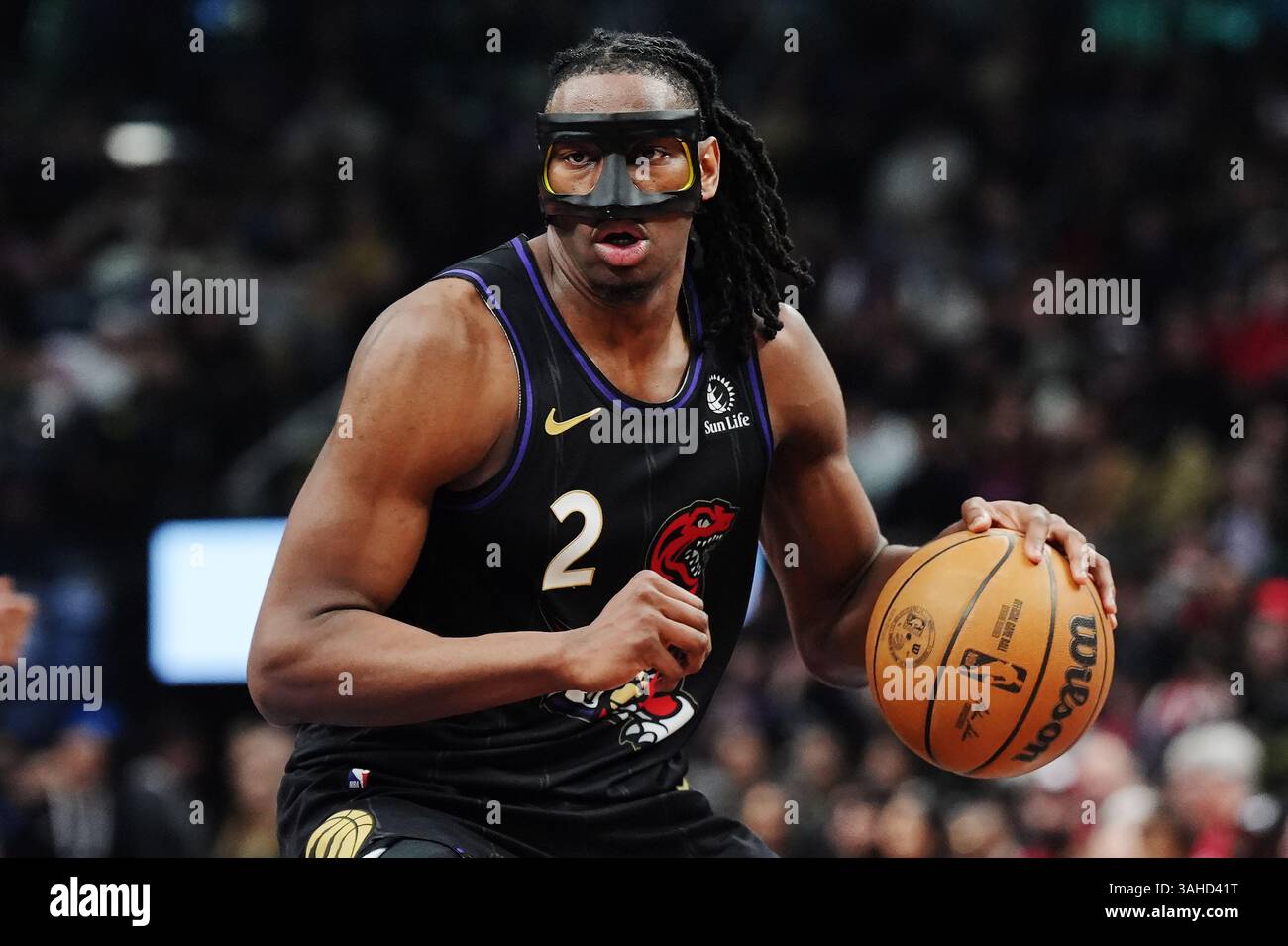 Toronto Raptors' Jonathan Mogbo (2) protects the ball during second ...