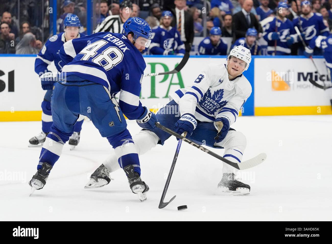 Toronto Maple Leafs center Steven Lorentz (18) knocks the puck away ...